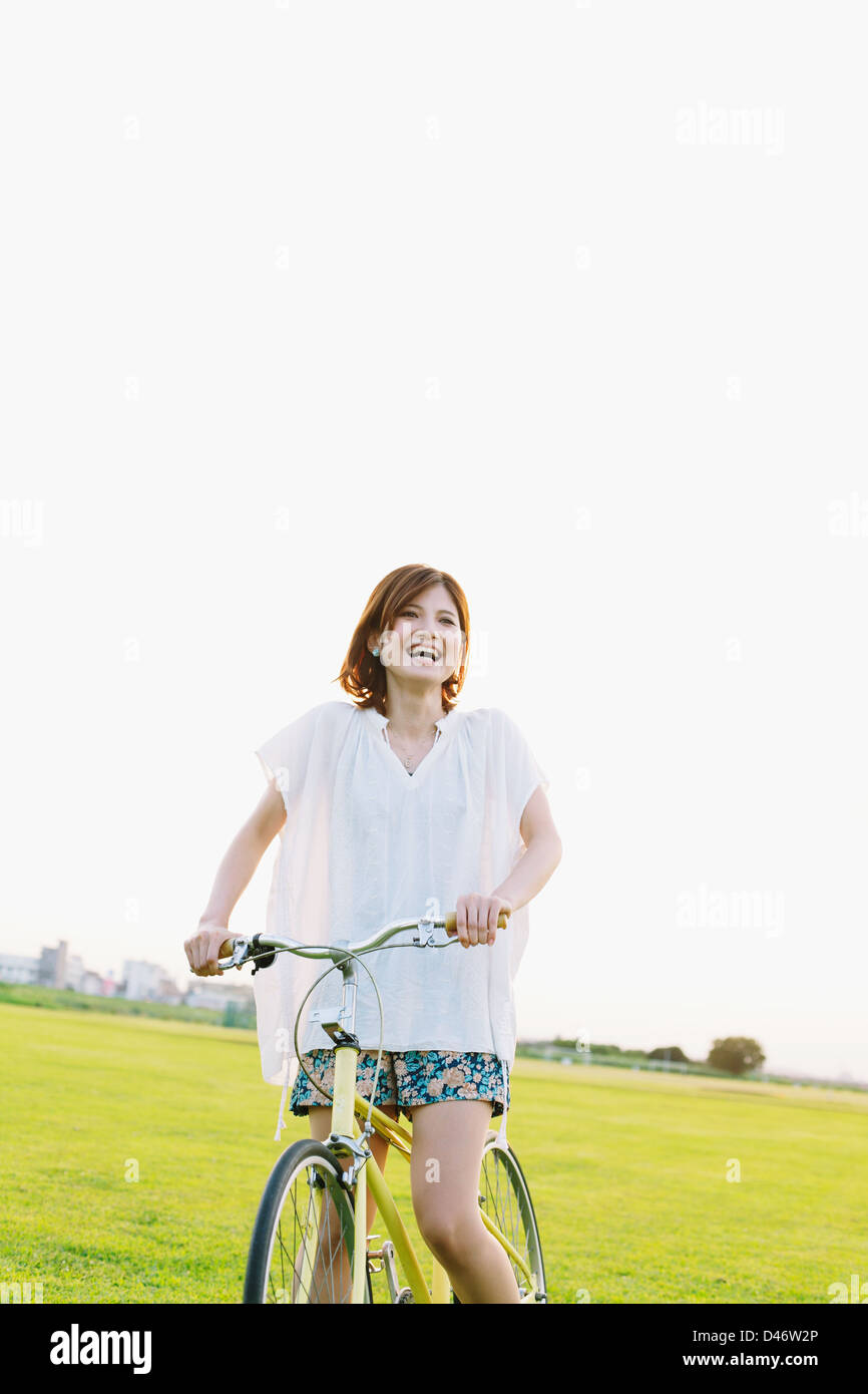 Woman Riding a Bicycle Stock Photo - Alamy