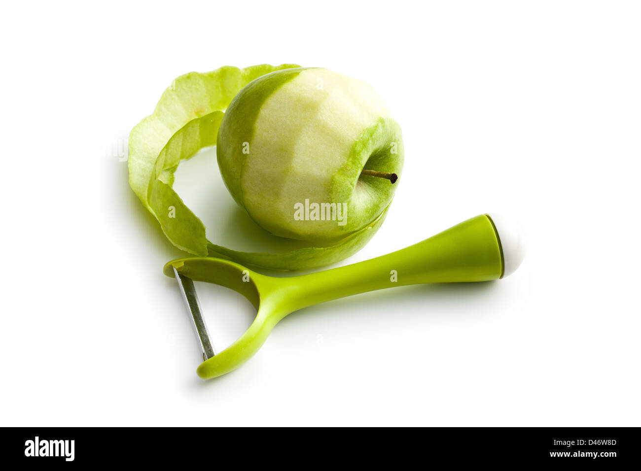 peeled green apple with peeler on white background Stock Photo - Alamy