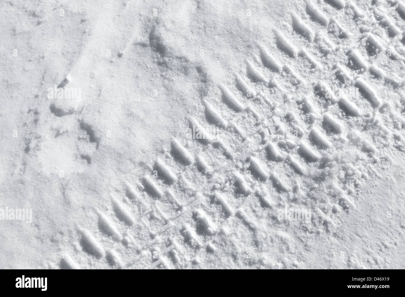 Background texture with tire tracks on road covered with snow Stock ...