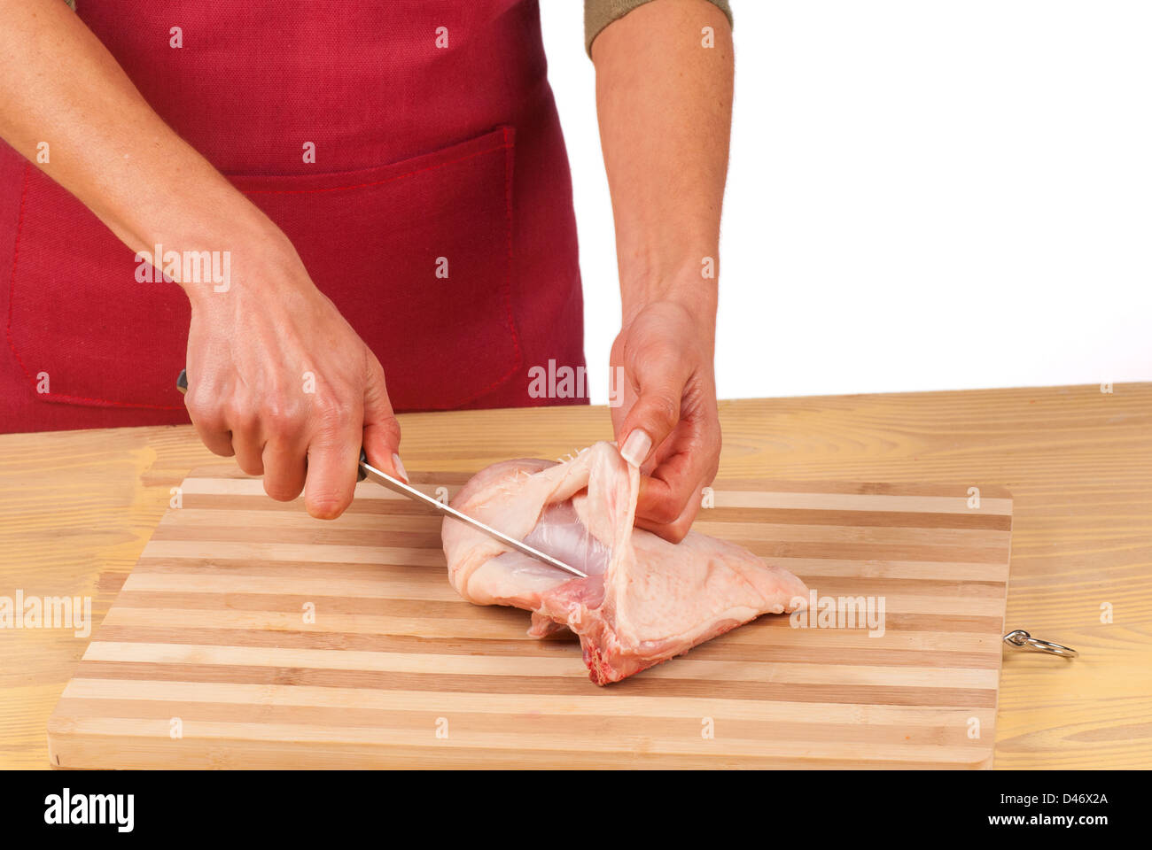 Hands cutting chicken meat piece hi-res stock photography and images ...