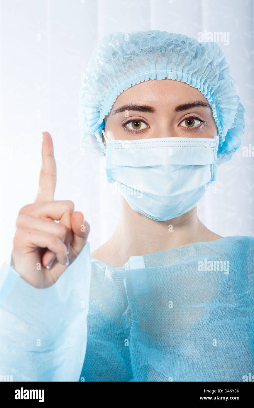 woman shows with his hand surgeon note warning Stock Photo - Alamy