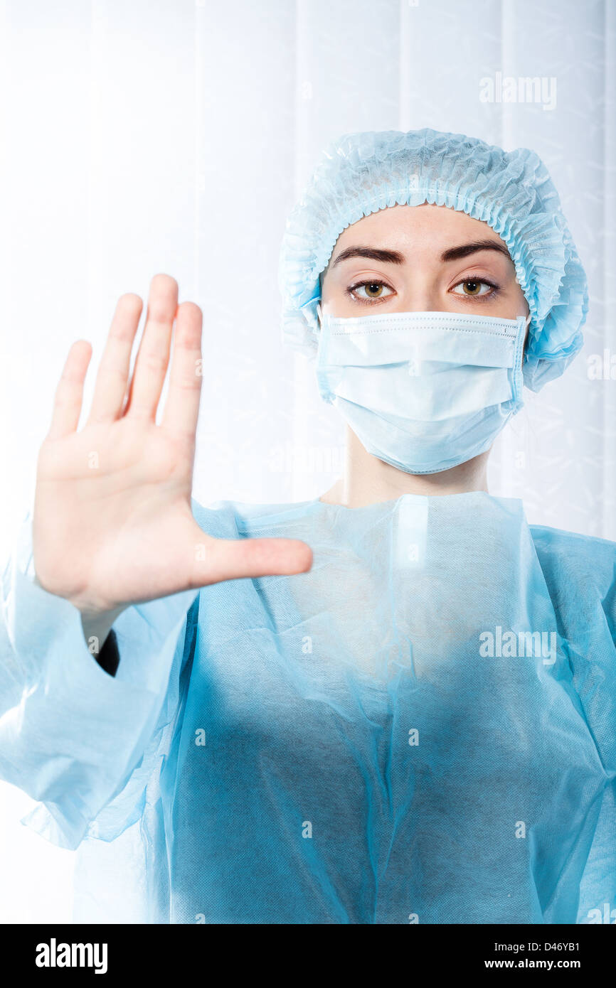 Portrait female doctor, surgeon shows stop sign with his hand Stock ...