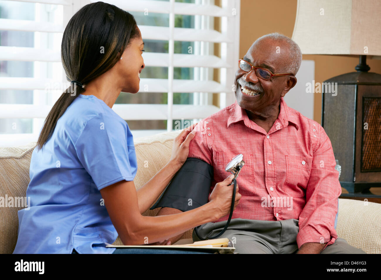 Nurse Visiting Senior Male Patient At Home Stock Photo - Alamy