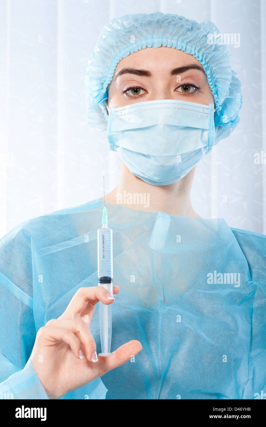 Portrait of woman doctor, surgeon with syringe. Closeup Stock Photo - Alamy