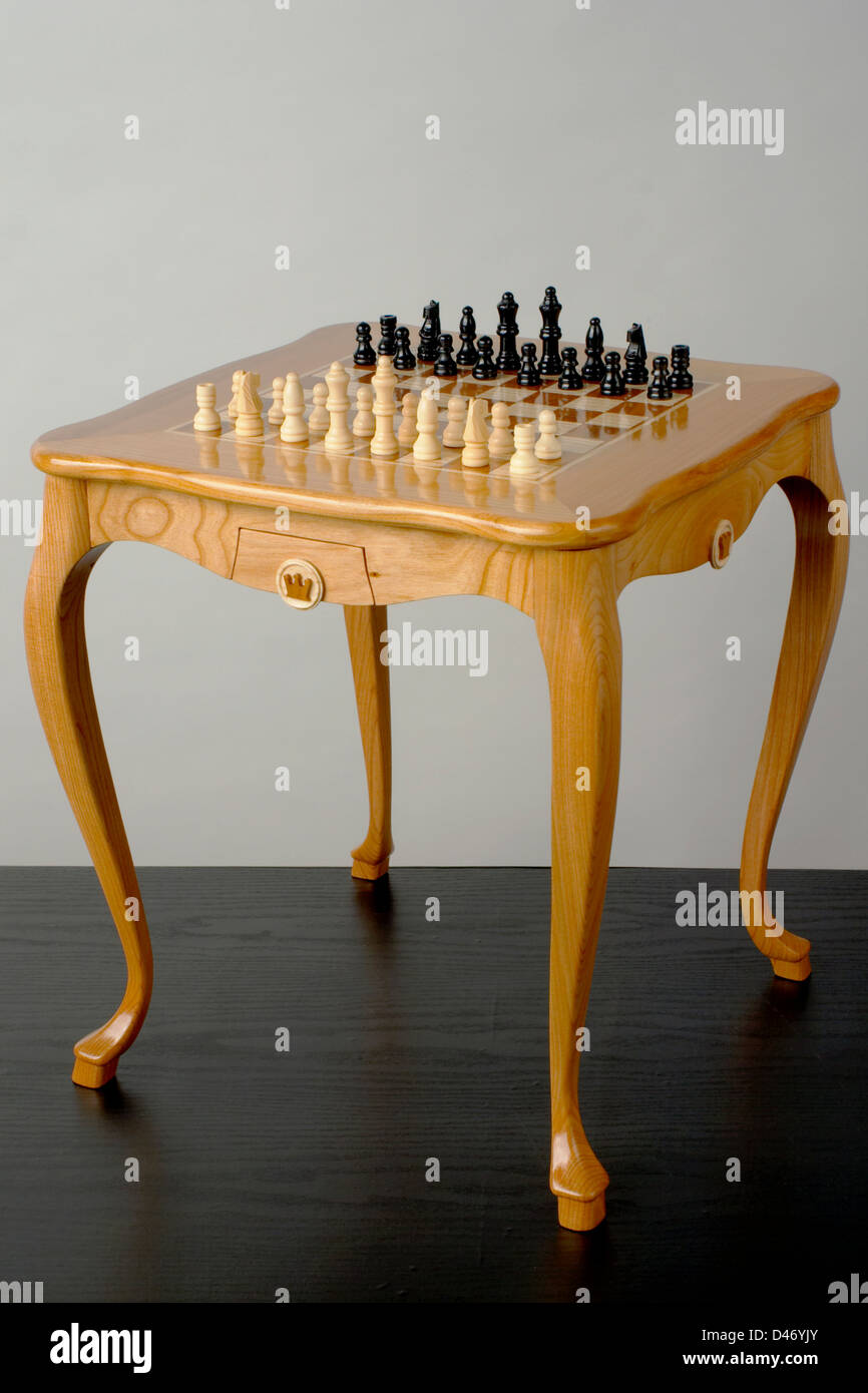 beautiful wooden table playing chess with chess pieces arranged Stock ...