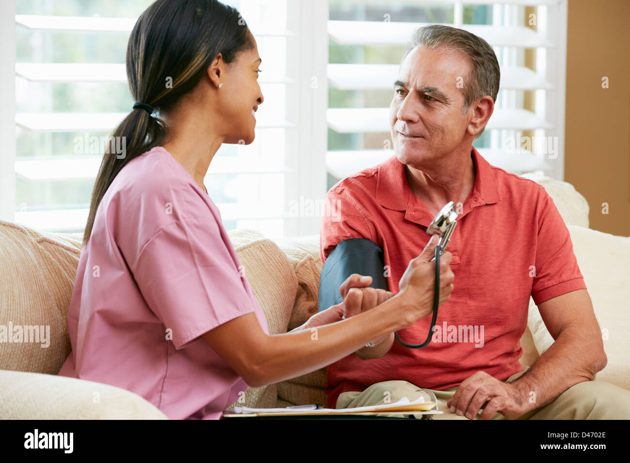 Nurse Visiting Senior Male Patient At Home Stock Photo - Alamy