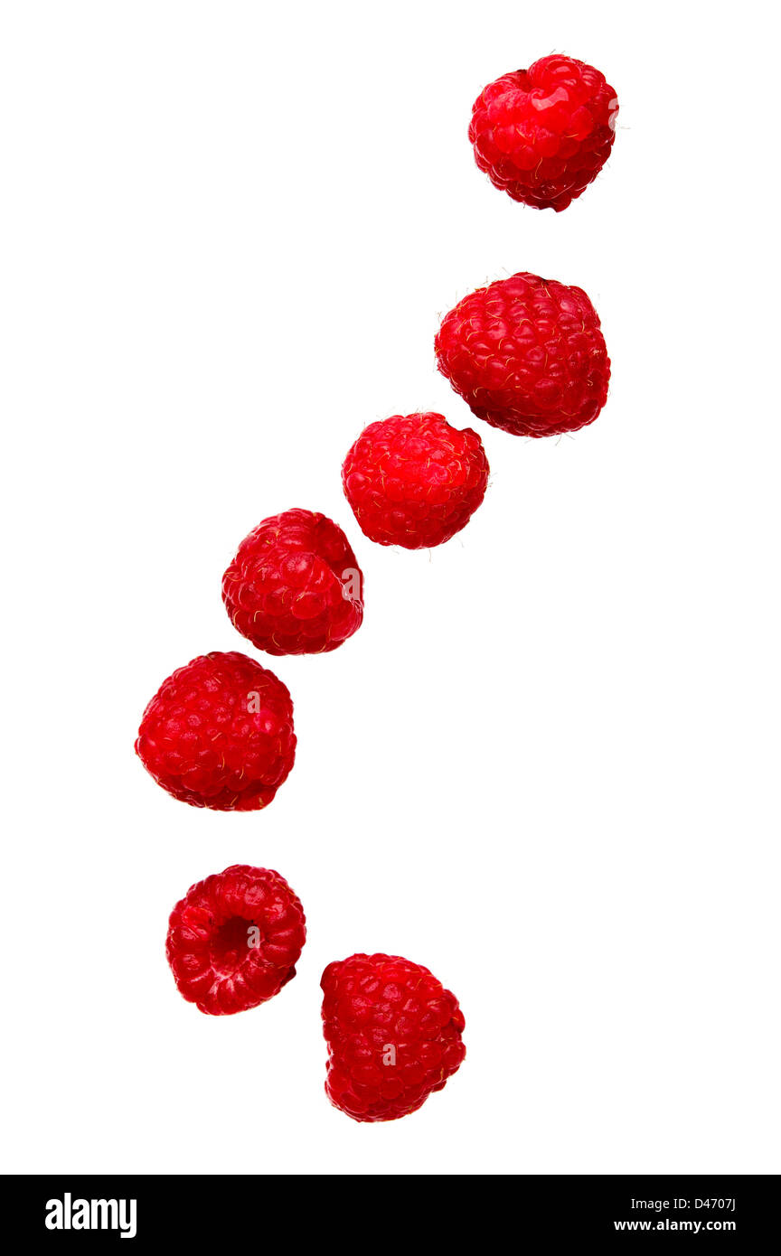 Seven raspberries falling isolated on a white background Stock Photo ...