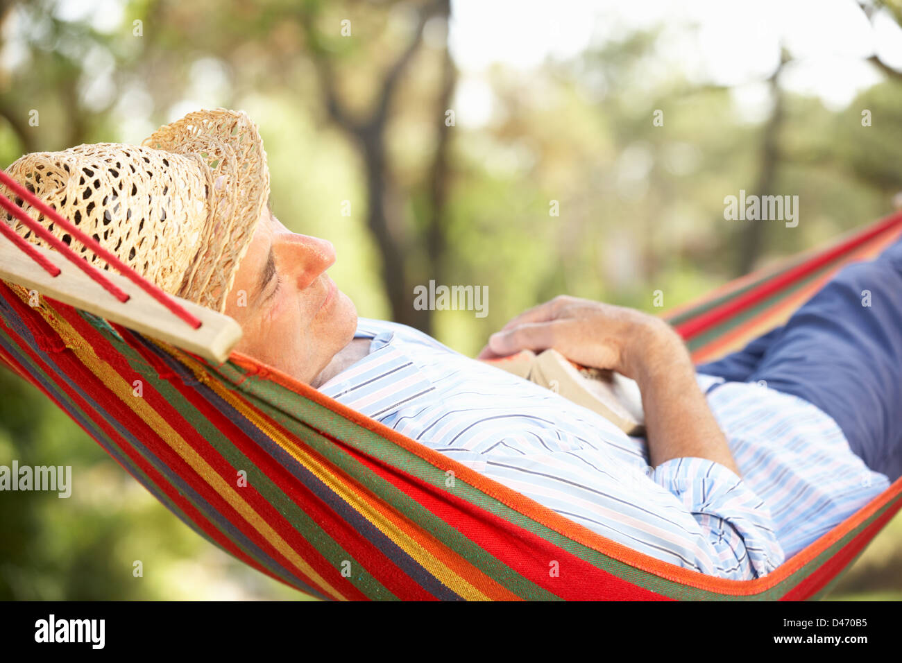 Senior Man Relaxing In Hammock Stock Photo - Alamy