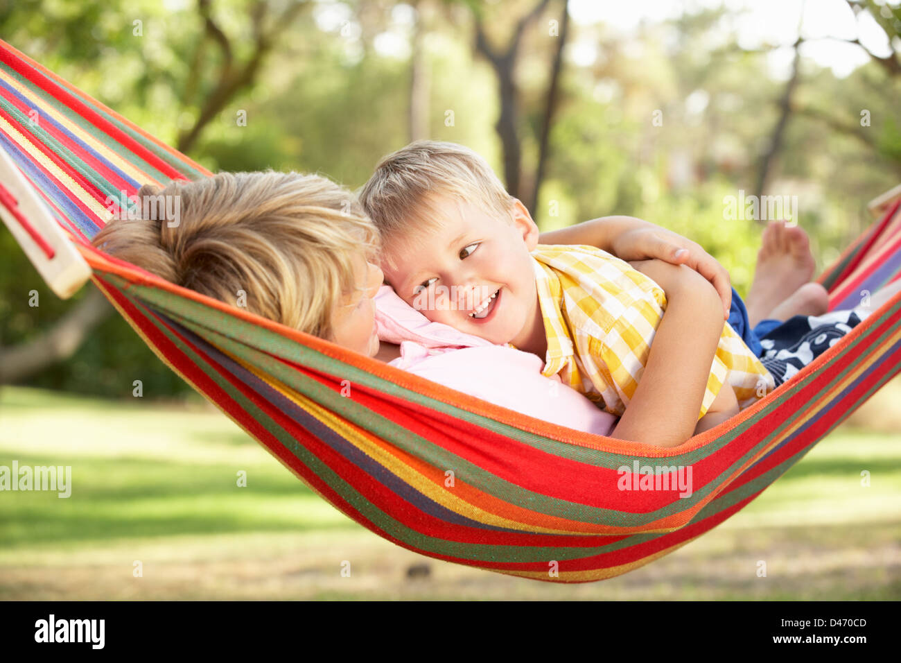 Boy relaxing in hammock hi-res stock photography and images - Alamy
