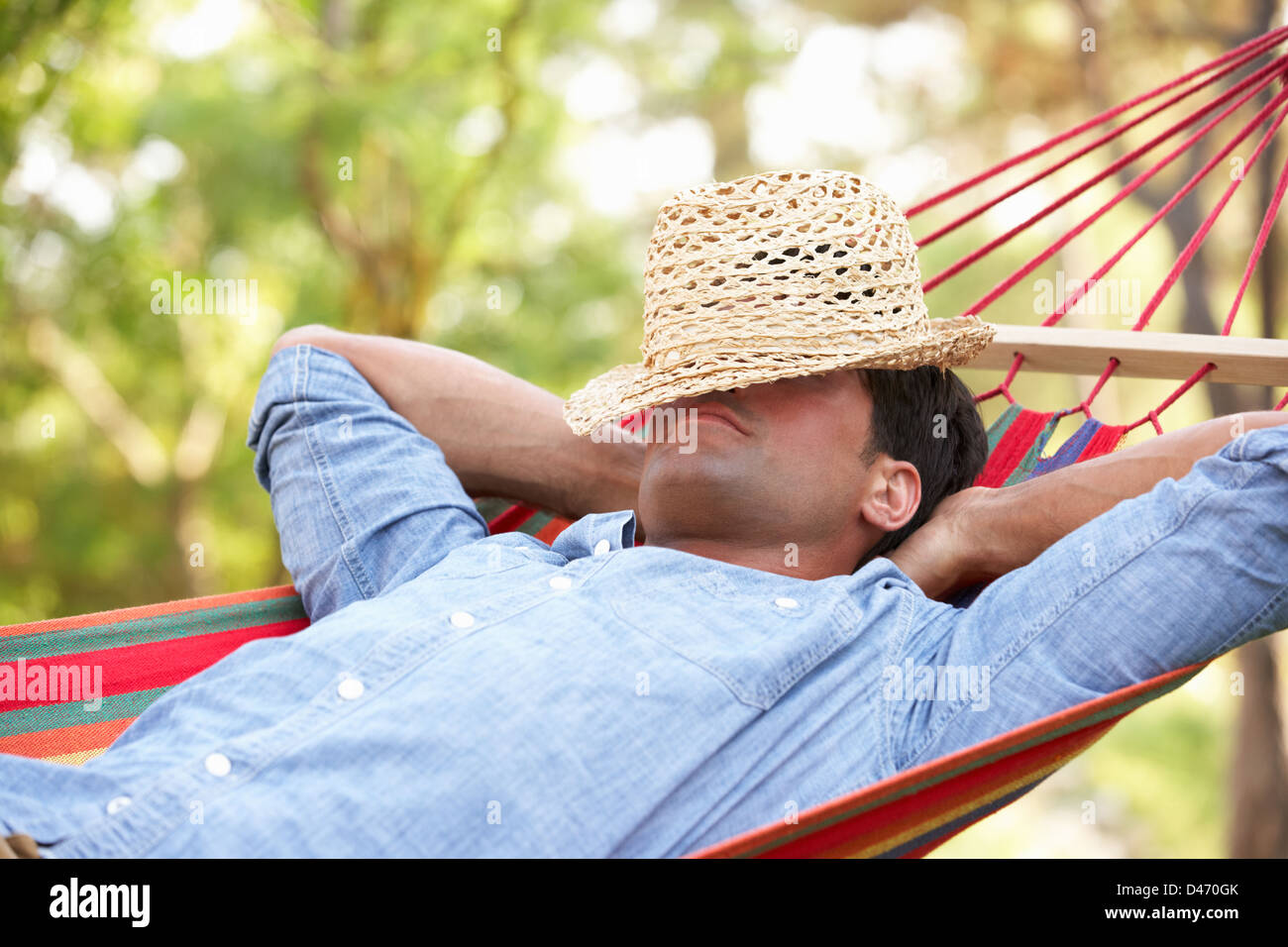 Man Relaxing In Hammock Stock Photo - Alamy
