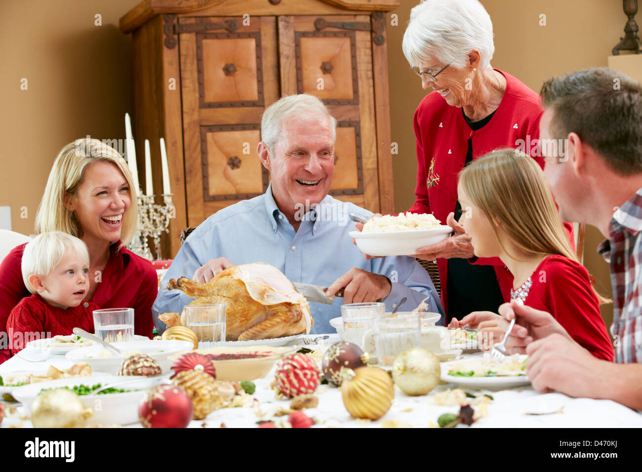 Multi Generation Family Celebrating With Christmas Meal Stock Photo - Alamy