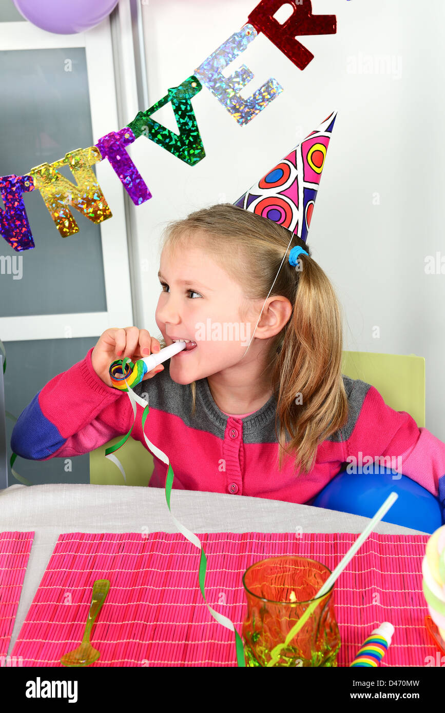 Happy little girl how have fun in a birthday party Stock Photo - Alamy