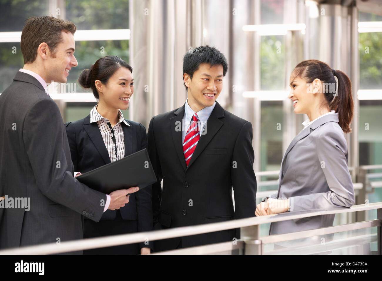 Four Business Colleagues Having Discussion Outside Office Stock Photo ...