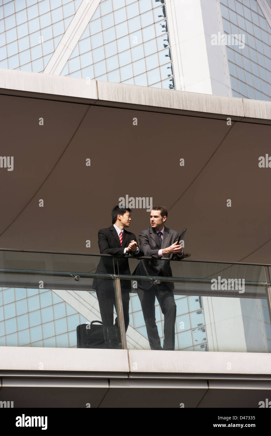 Two Business Colleagues Having Discussion Outside Office Building Stock ...