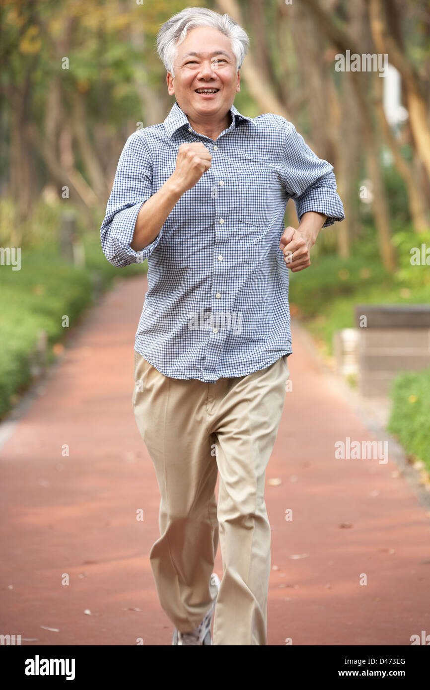 Senior Chinese Man Jogging In Park Stock Photo - Alamy