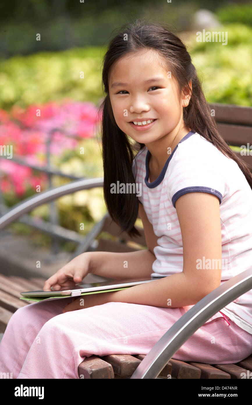 Girl sitting on bench hi-res stock photography and images - Alamy