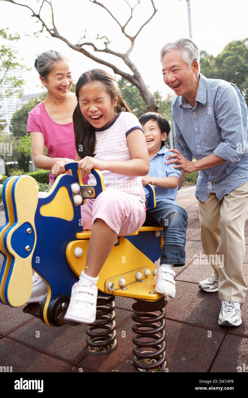Asian Grandparents Playing With Grandchildren