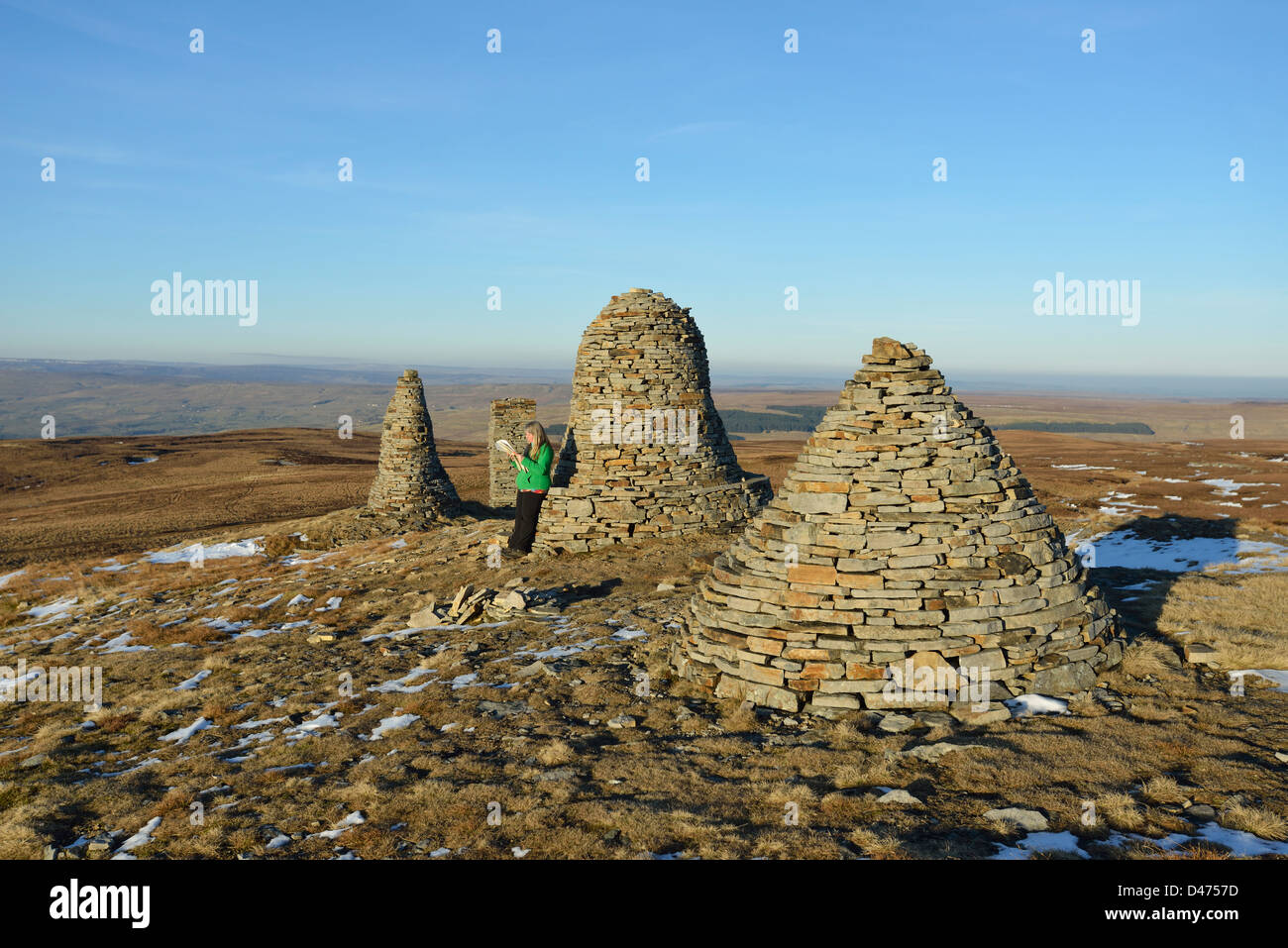 Walker with O.S. map at Nine Standards Rigg. Hartley Fell, Cumbria ...