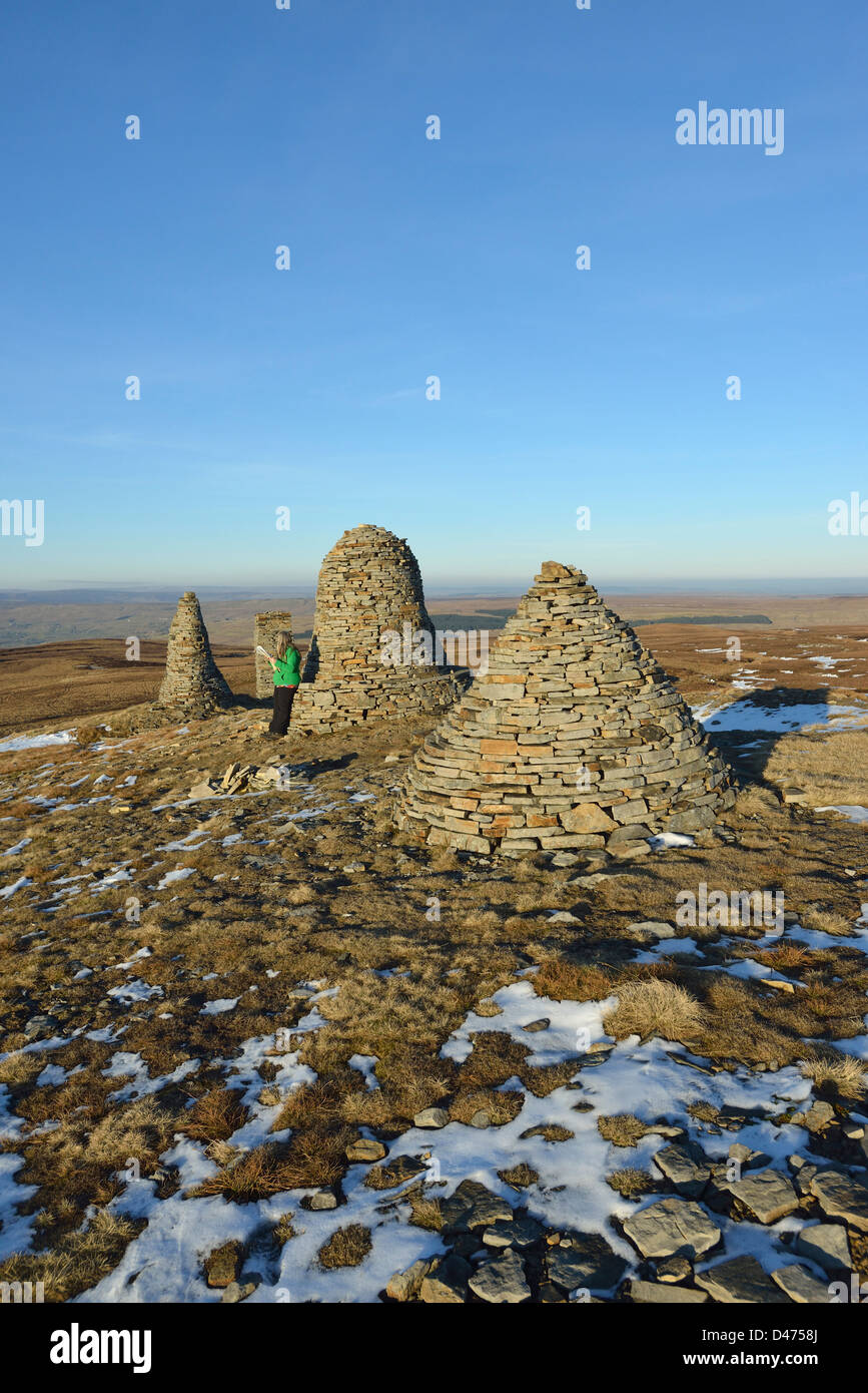 Walker with O.S. map at Nine Standards Rigg. Hartley Fell, Cumbria ...