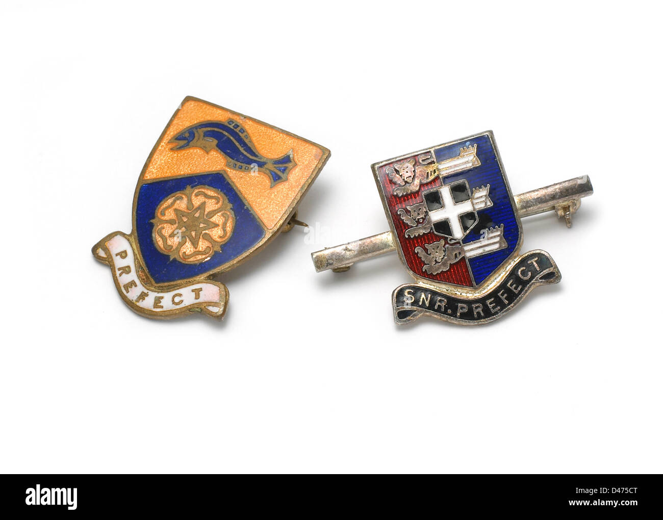 Pair of prefect badges cut out white background Stock Photo - Alamy