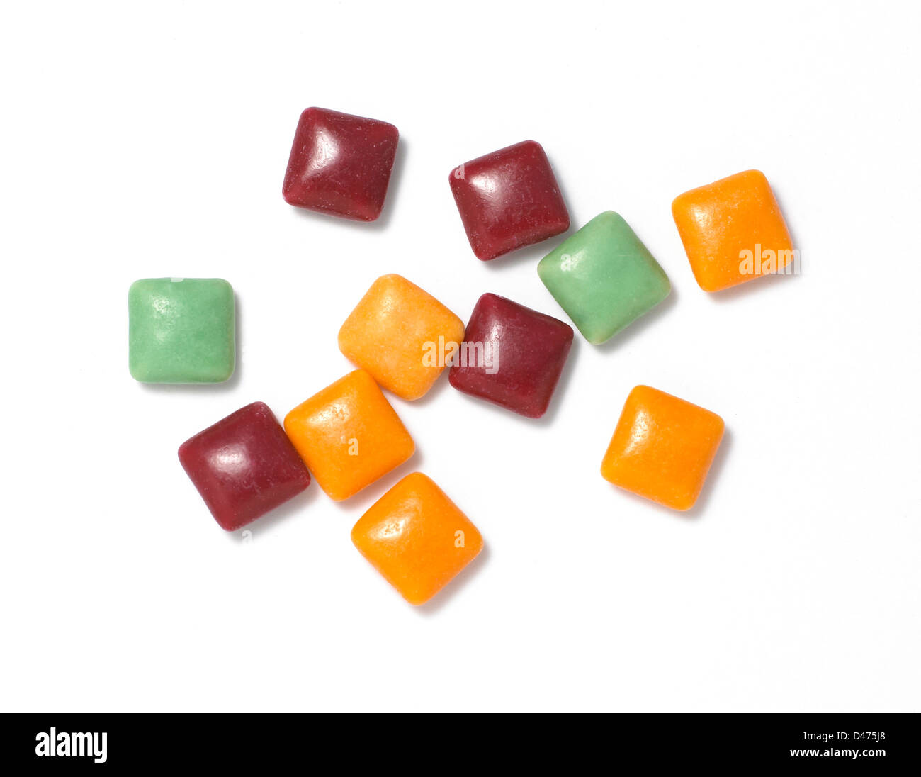 Selection of different coloured sweets cut out white background Stock ...