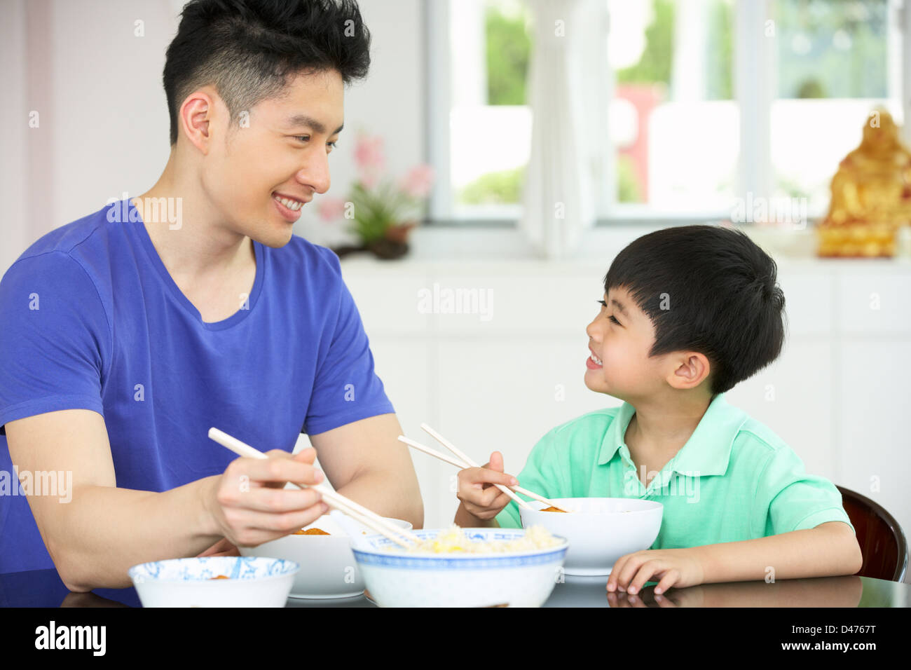 Chinese father and son eating rice hi-res stock photography and images ...