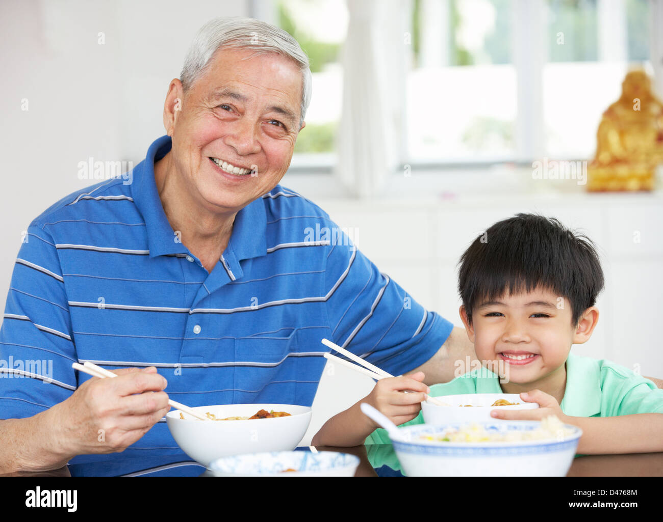 Portrait chinese grandfather grandson eating hi-res stock photography ...