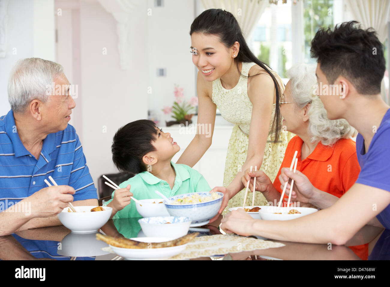 Portrait Of Multi-Generation Chinese Family Eating Meal Together Stock ...
