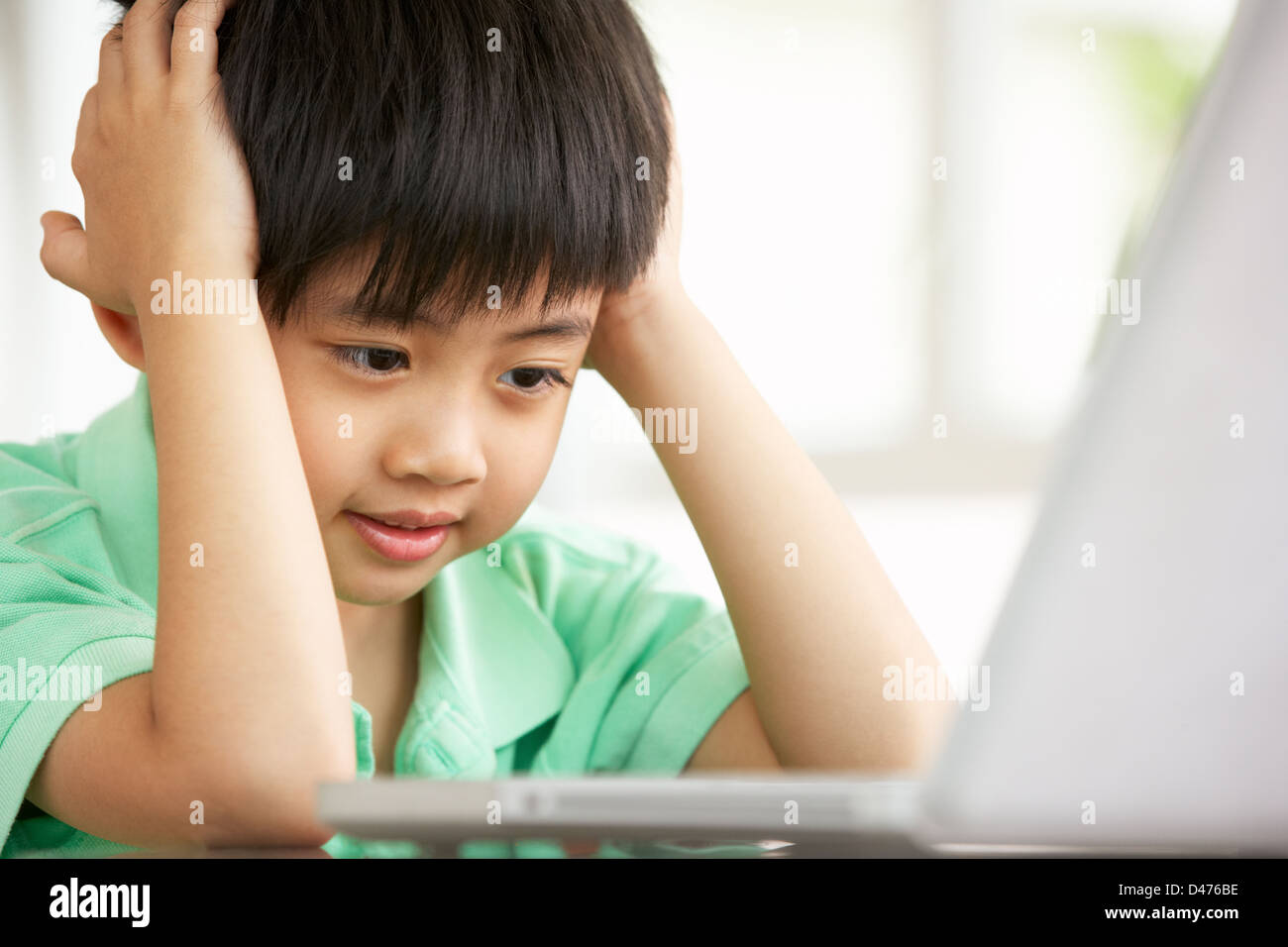 Child laptop asia hi-res stock photography and images - Alamy