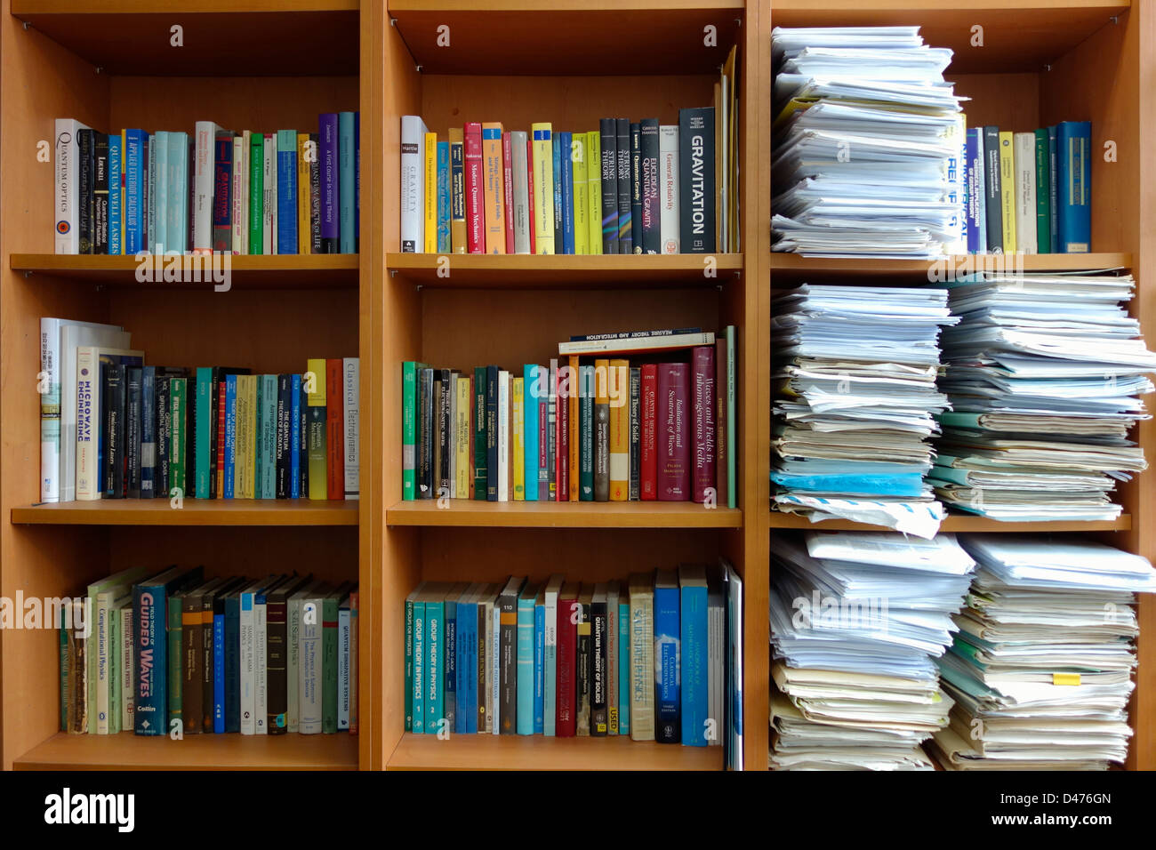 Bookshelf of scientist Stock Photo - Alamy