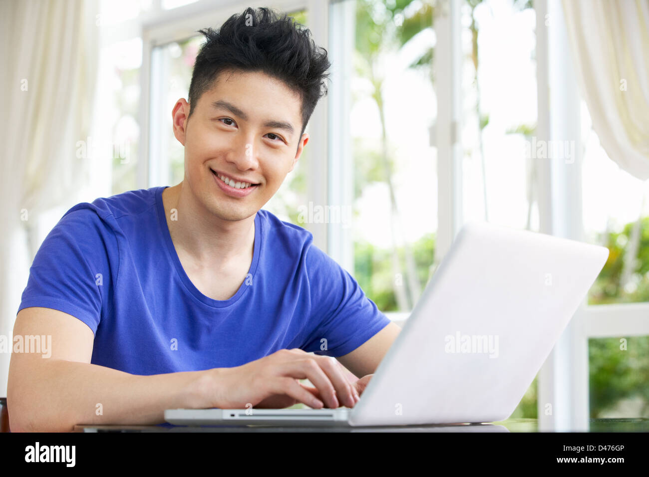 Asian man working home sitting hi-res stock photography and images - Alamy