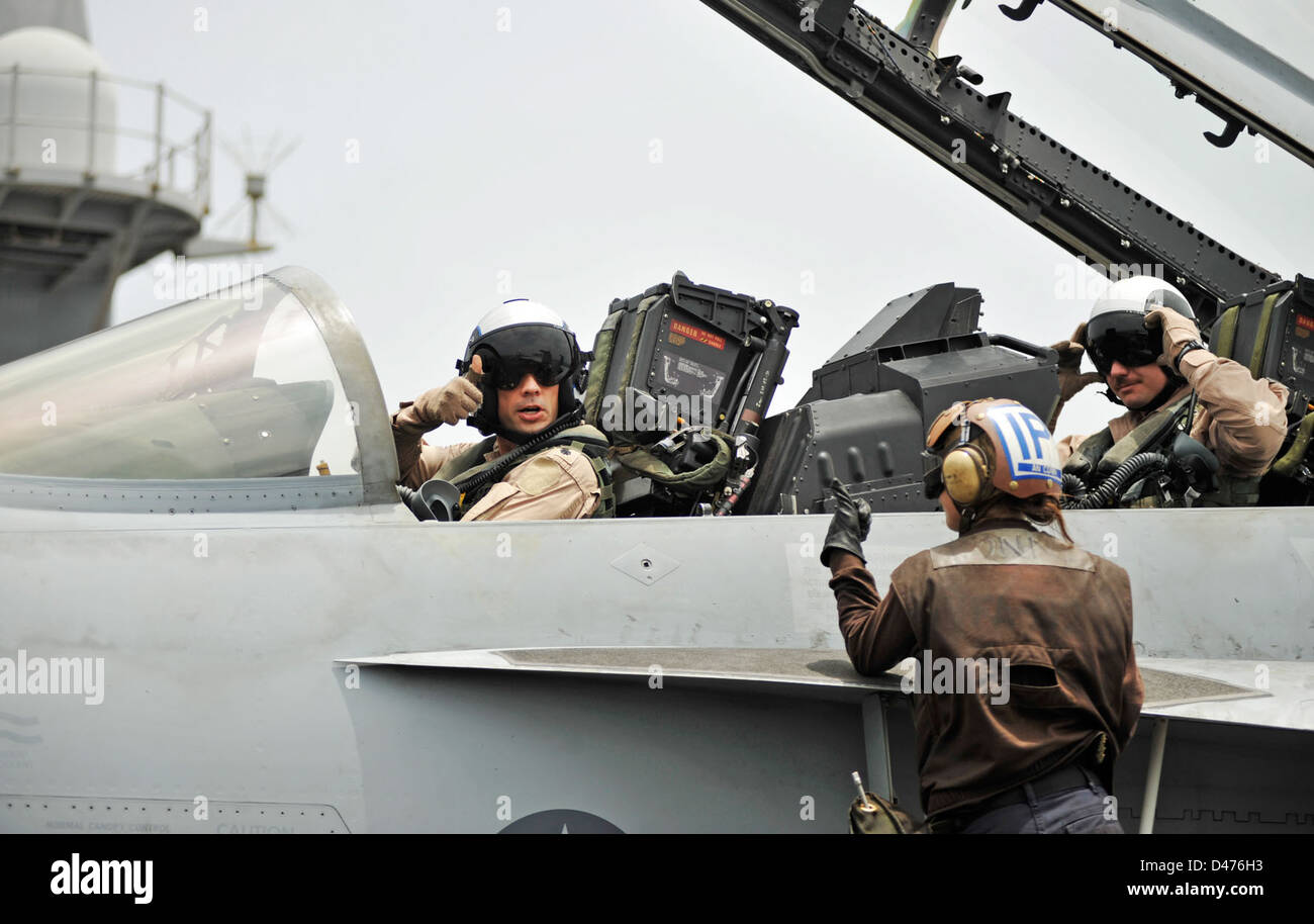 A commander signals a thumbs up after completing pre-flight checks on ...