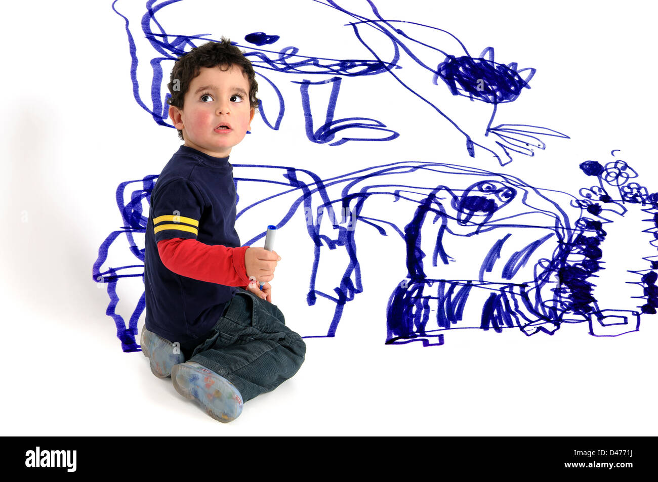 Young artistic boy doing wall painting Stock Photo - Alamy