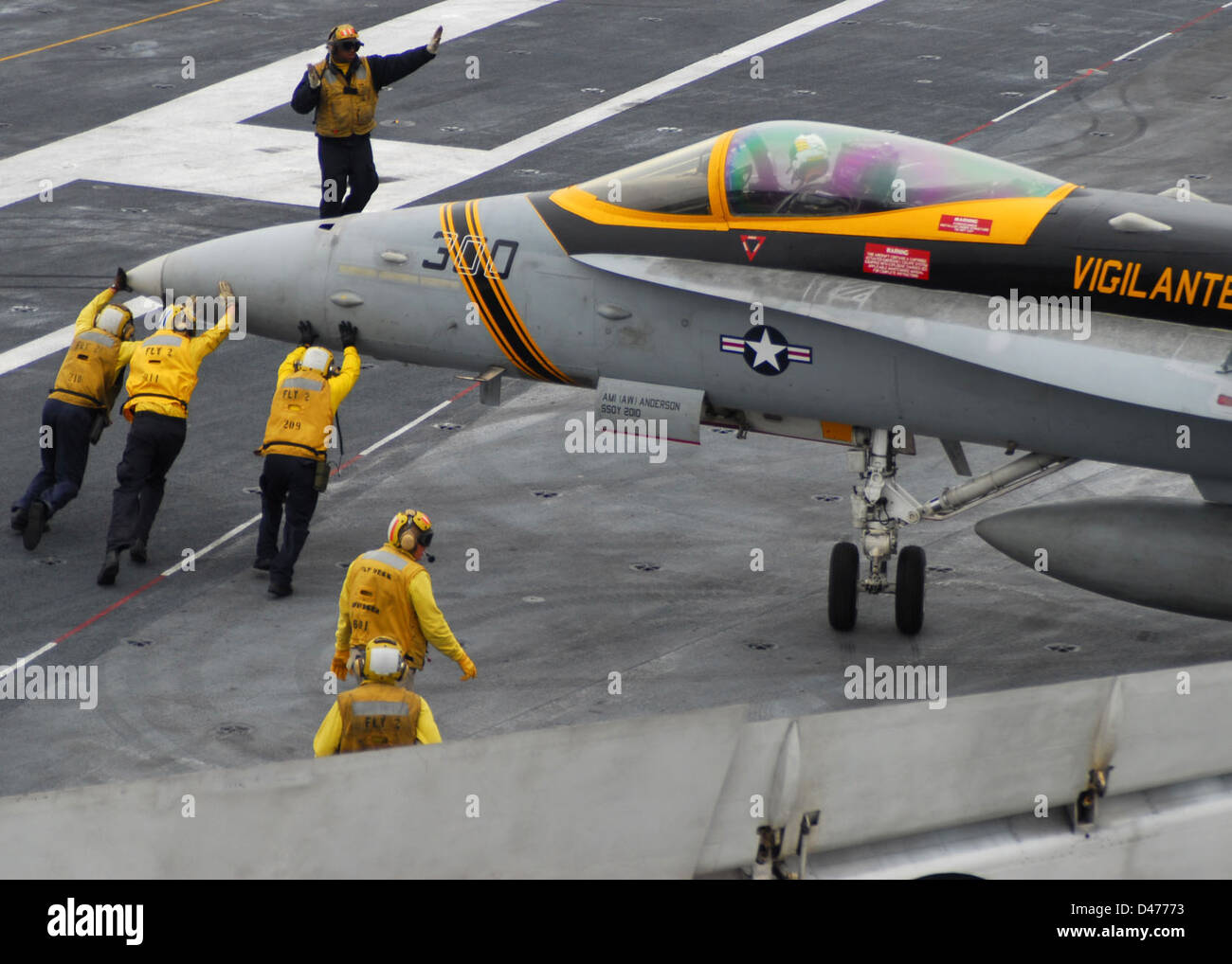 Aircraft handling crew aboard hi-res stock photography and images - Alamy