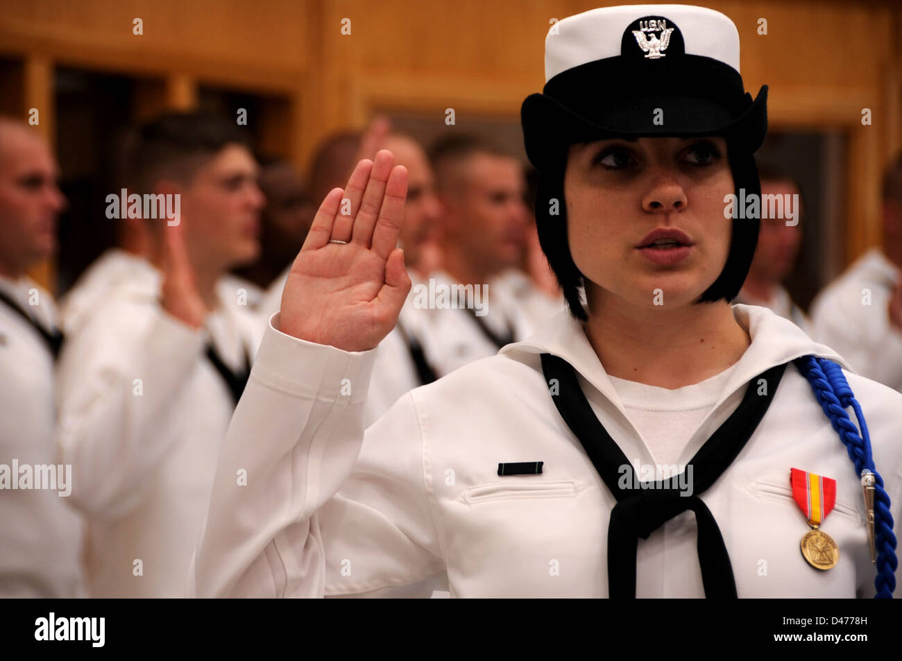 A Sailor recites the Hospital Corps Pledge during the disestablishment ...