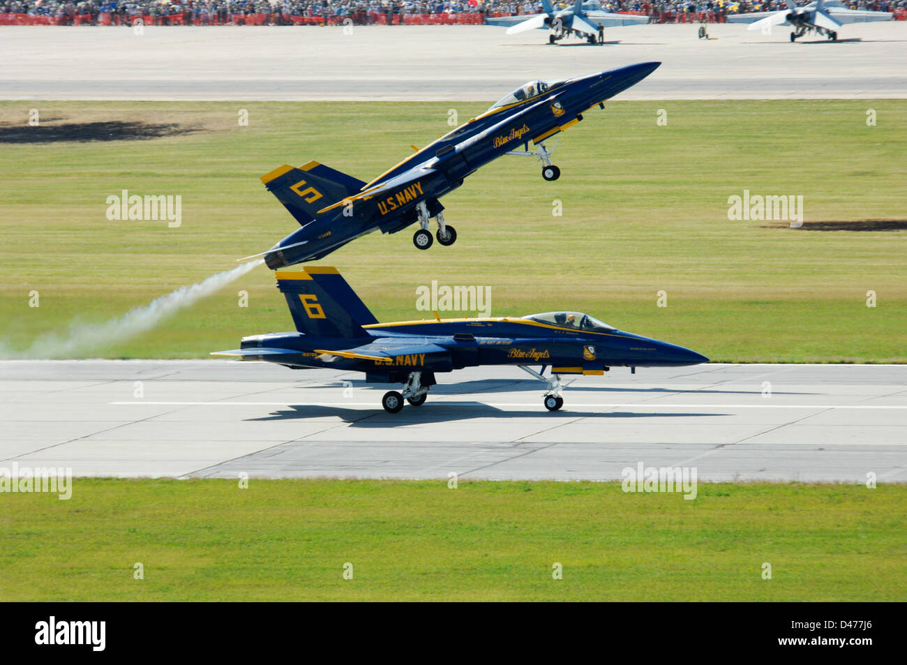 Two Blue Angels execute the Dirty Roll on Takeoff maneuver during a ...