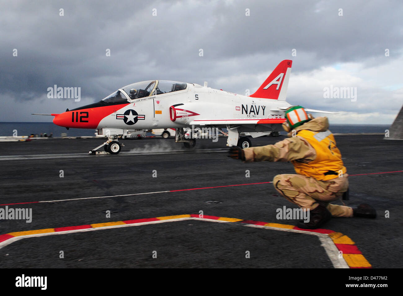 Sailors aboard a U.S. Navy ship launch a training aircraft for flight ...
