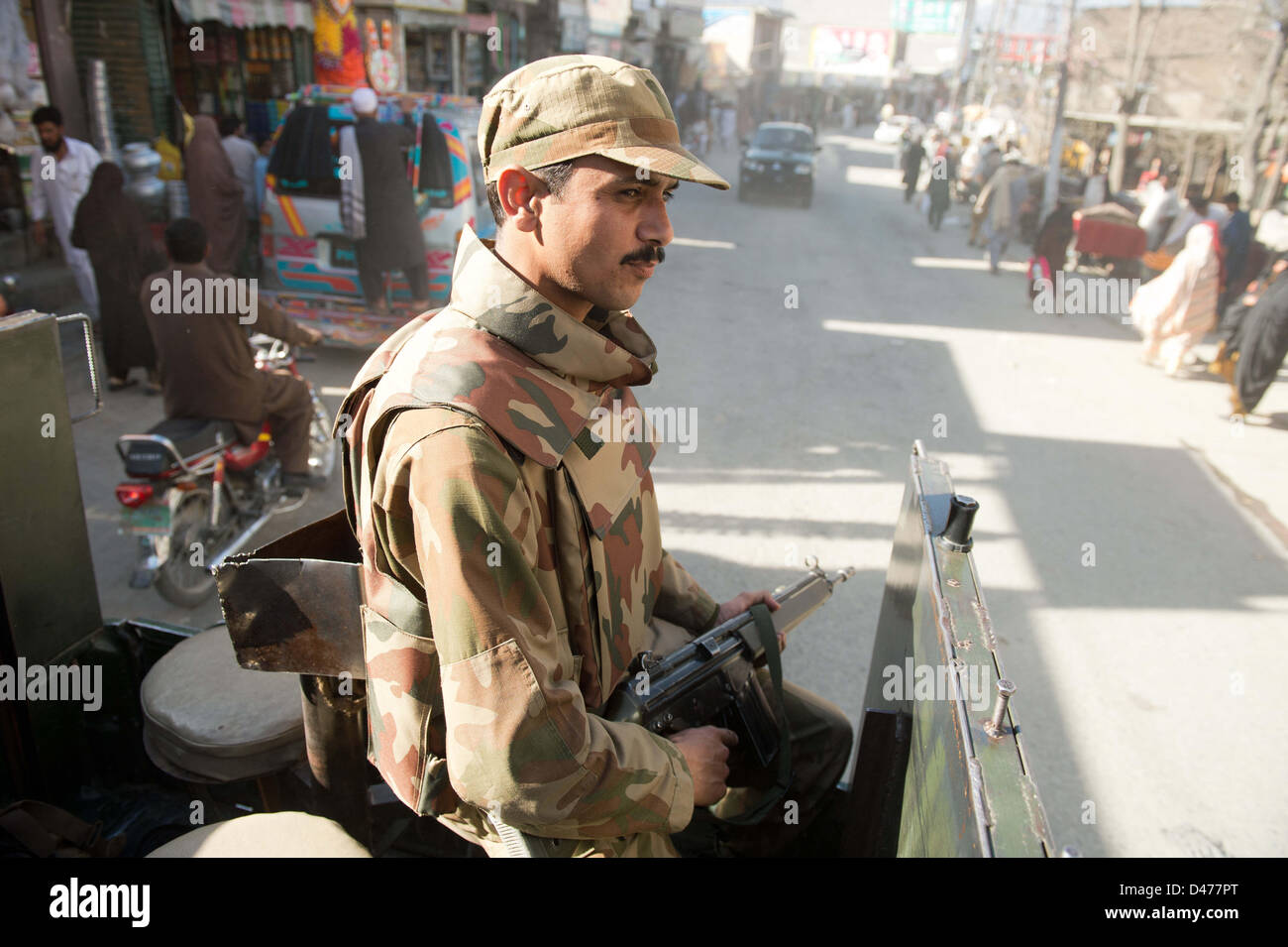 Pakistan soldiers drive on patrol through the Swat valley in Khwaza ...
