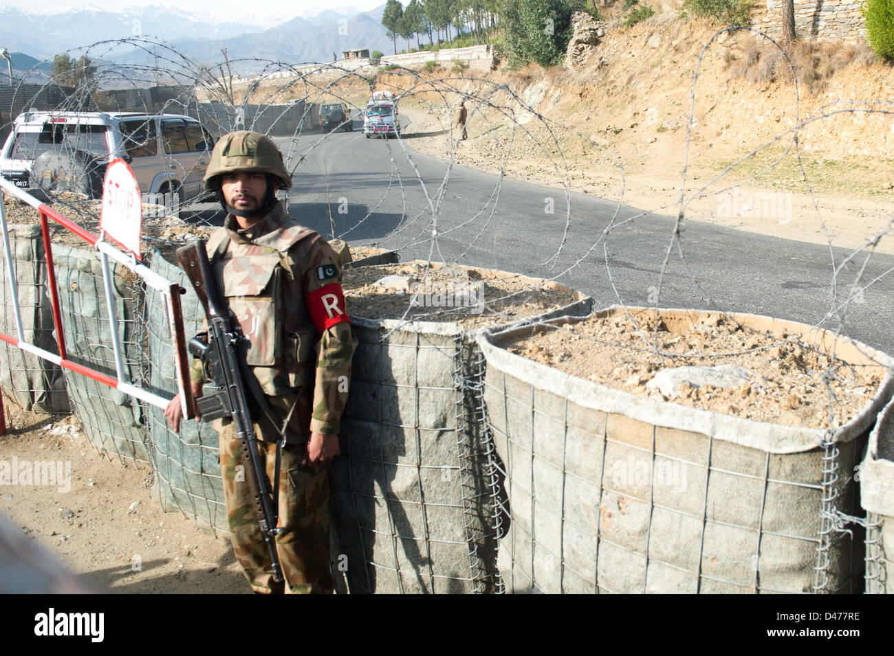 A Pakistani soldier secures the entrance to a post in the Swat valley ...