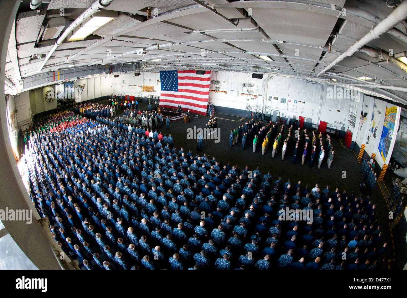 Sailors stand in ranks during a military formation, exemplifying ...