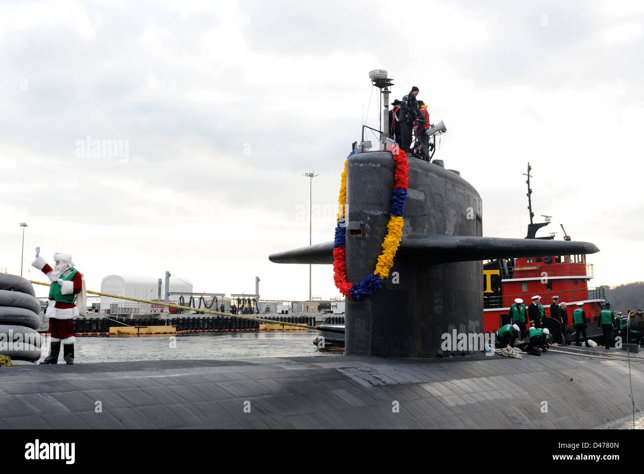 Santa waves to families on the pier at the Submarine Base New London ...