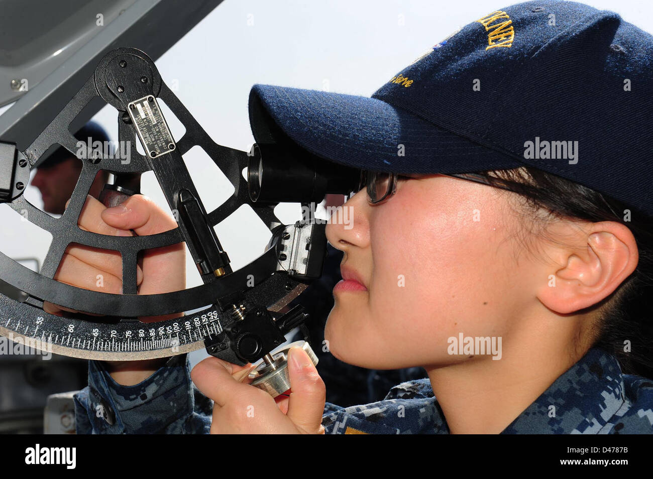 A Sailor uses a statometer to measure range aboard USS Pinckney Stock ...