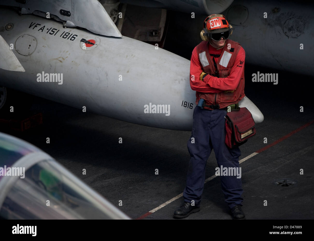 A Sailor stands by during flight operations Stock Photo - Alamy