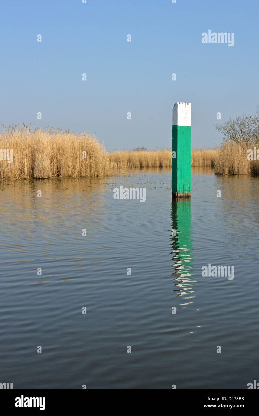 Navigation post reflecting in the water, Deep Go Dyke, between Hickling ...