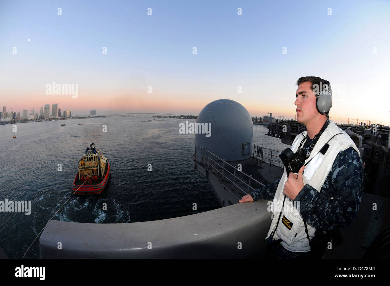 A Sailor performs portside watch duties during sea and anchor detail ...