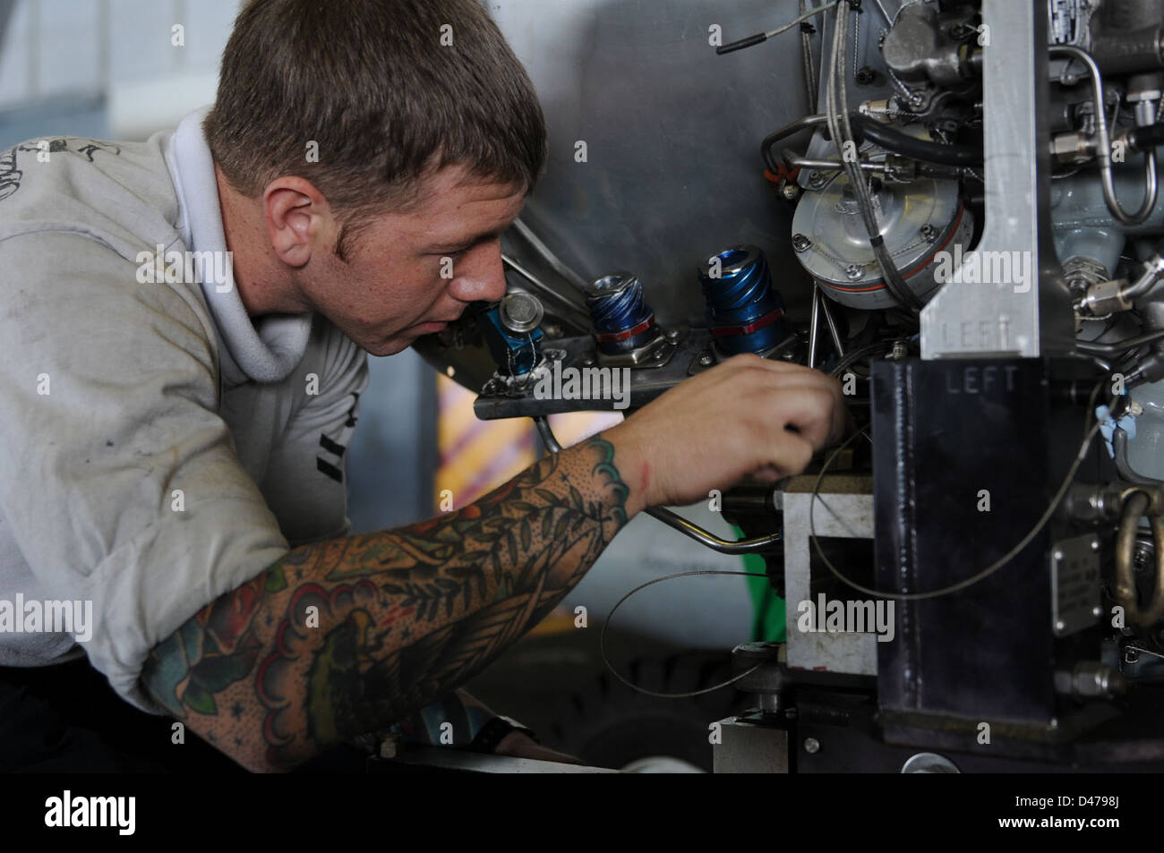 A Sailor conducts maintenance on a naval power plant, ensuring the ...