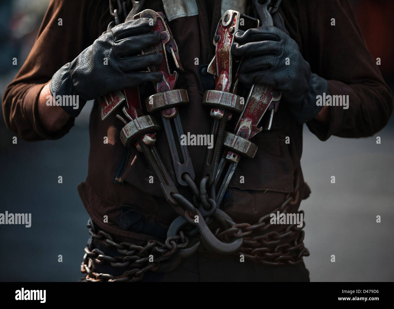 A Sailor aboard the USS Carl Vinson awaits to chalk and chain an ...