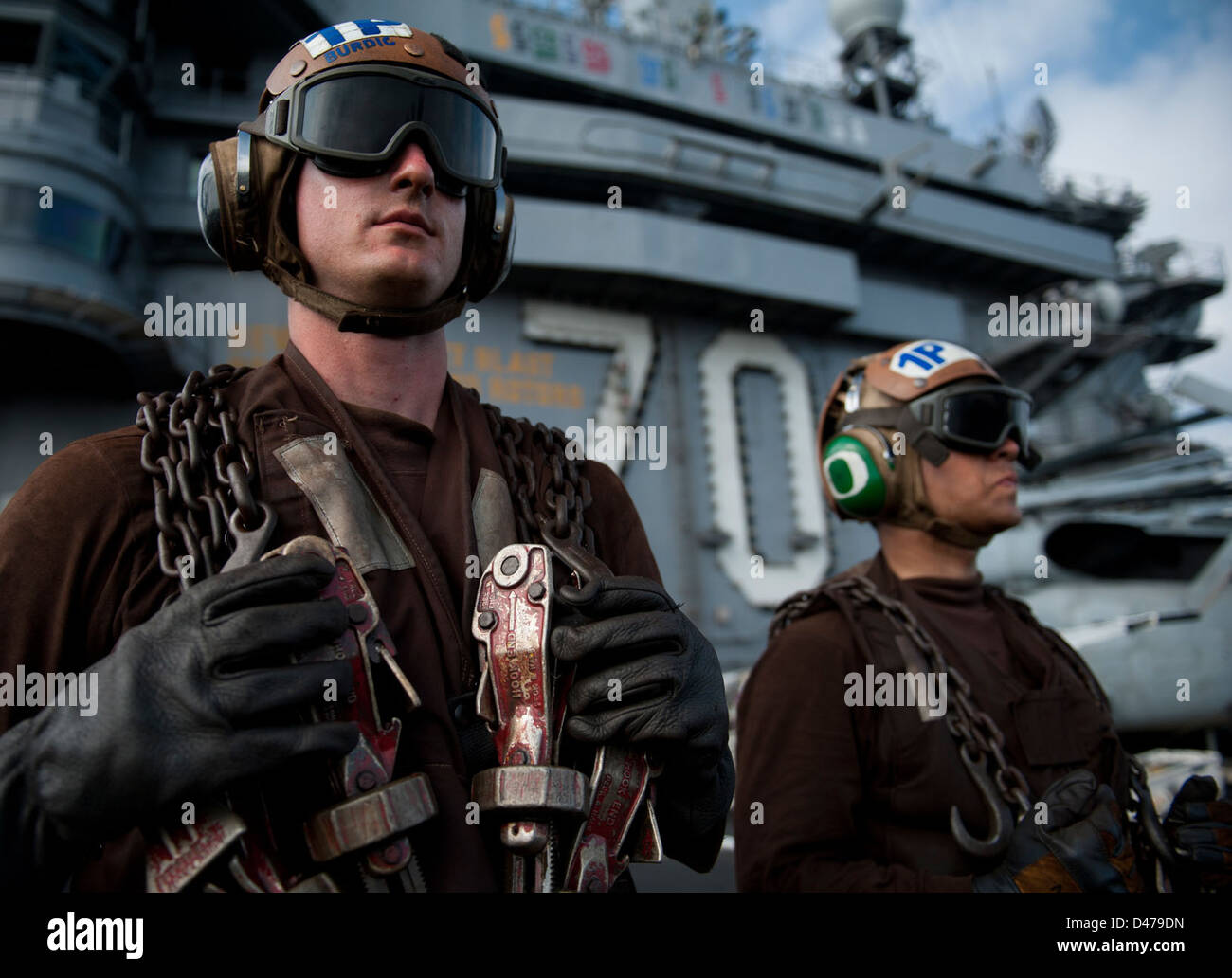 Sailors aboard the USS Carl Vinson stand ready to chalk and chain ...