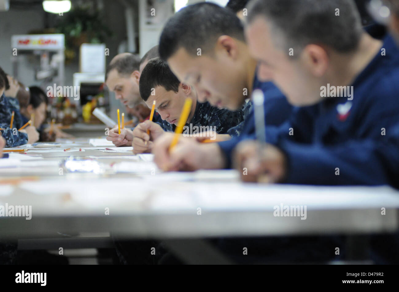 Sailors aboard a naval ship in the Arabian Sea take the chief petty ...