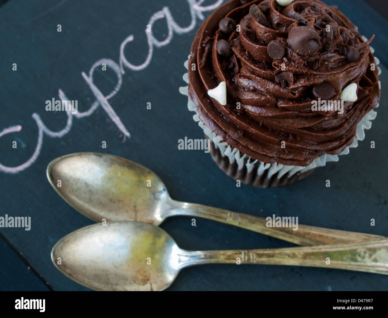 Gourmet quadruple chocolate Cupcake on chalk board Stock Photo - Alamy